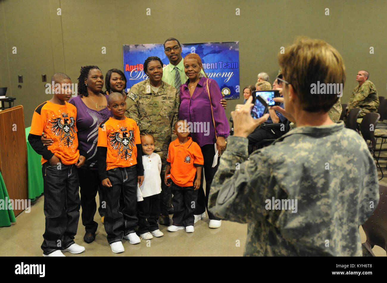 Sgt. Luwanda Knuckles gathers with her family during a departure ...