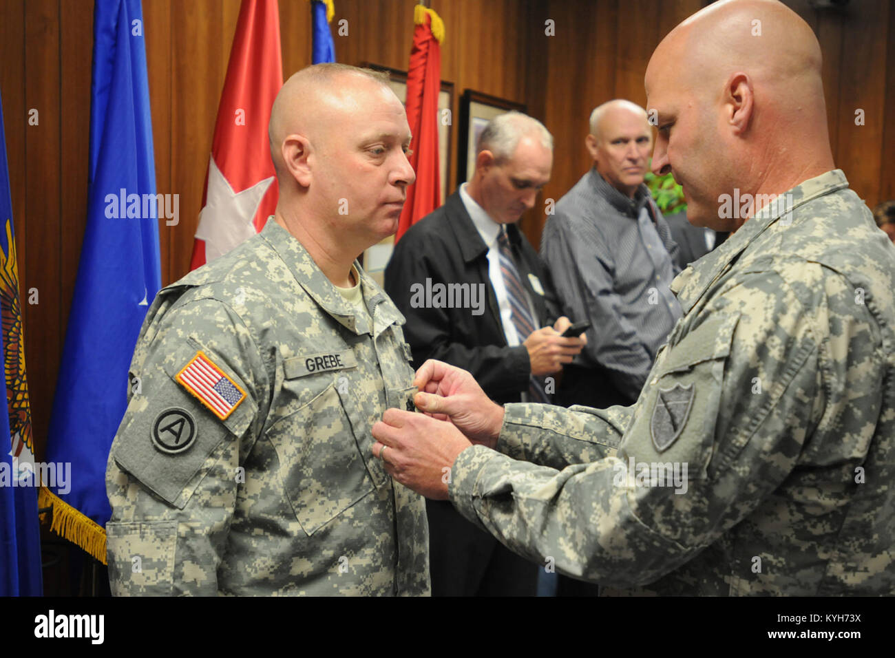 Maj. David Grebe is promoted to the rank of lieutenant colonel during a ...