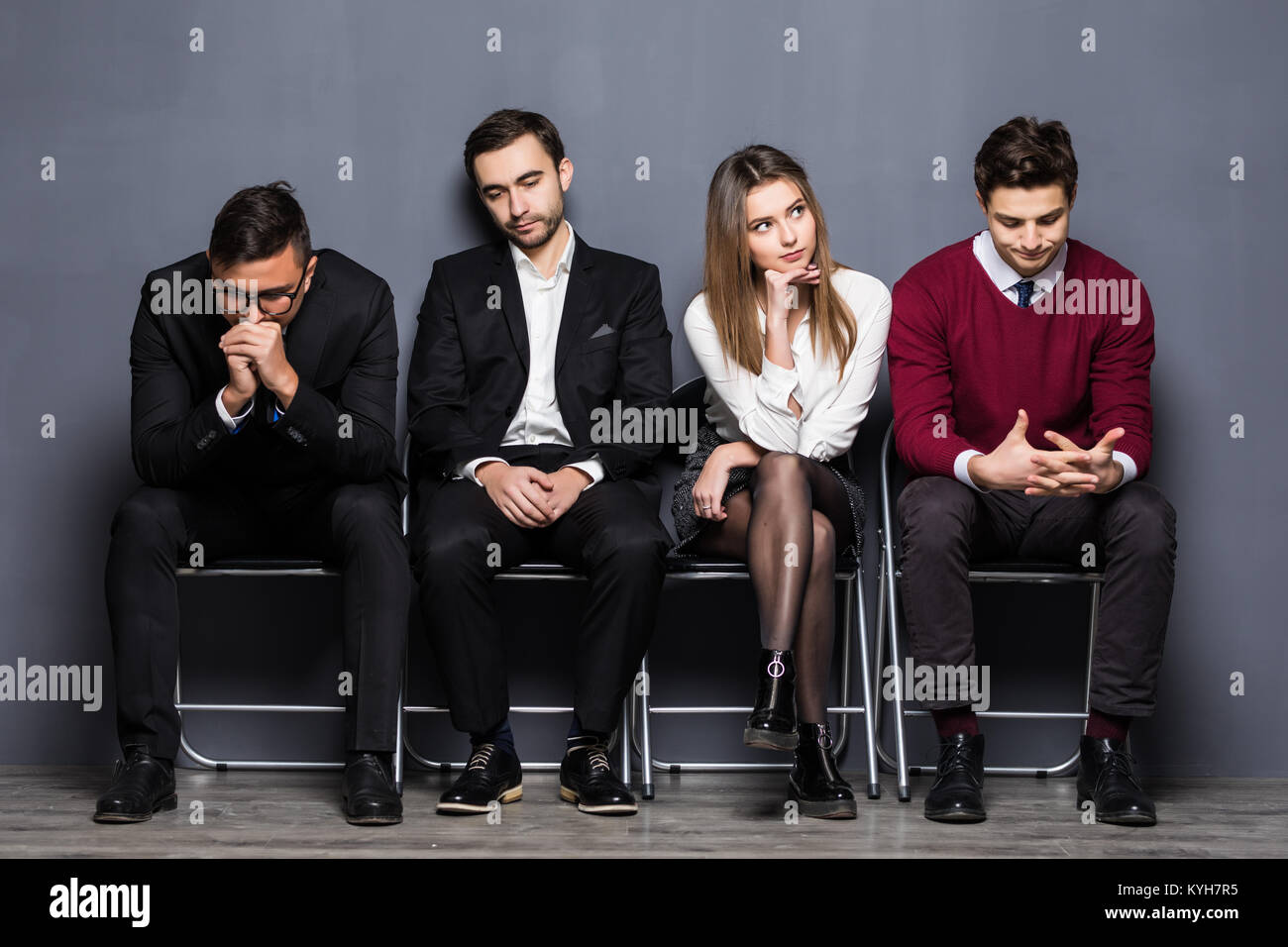Business People Are Getting Bored While Sitting On Chair Waiting For ...