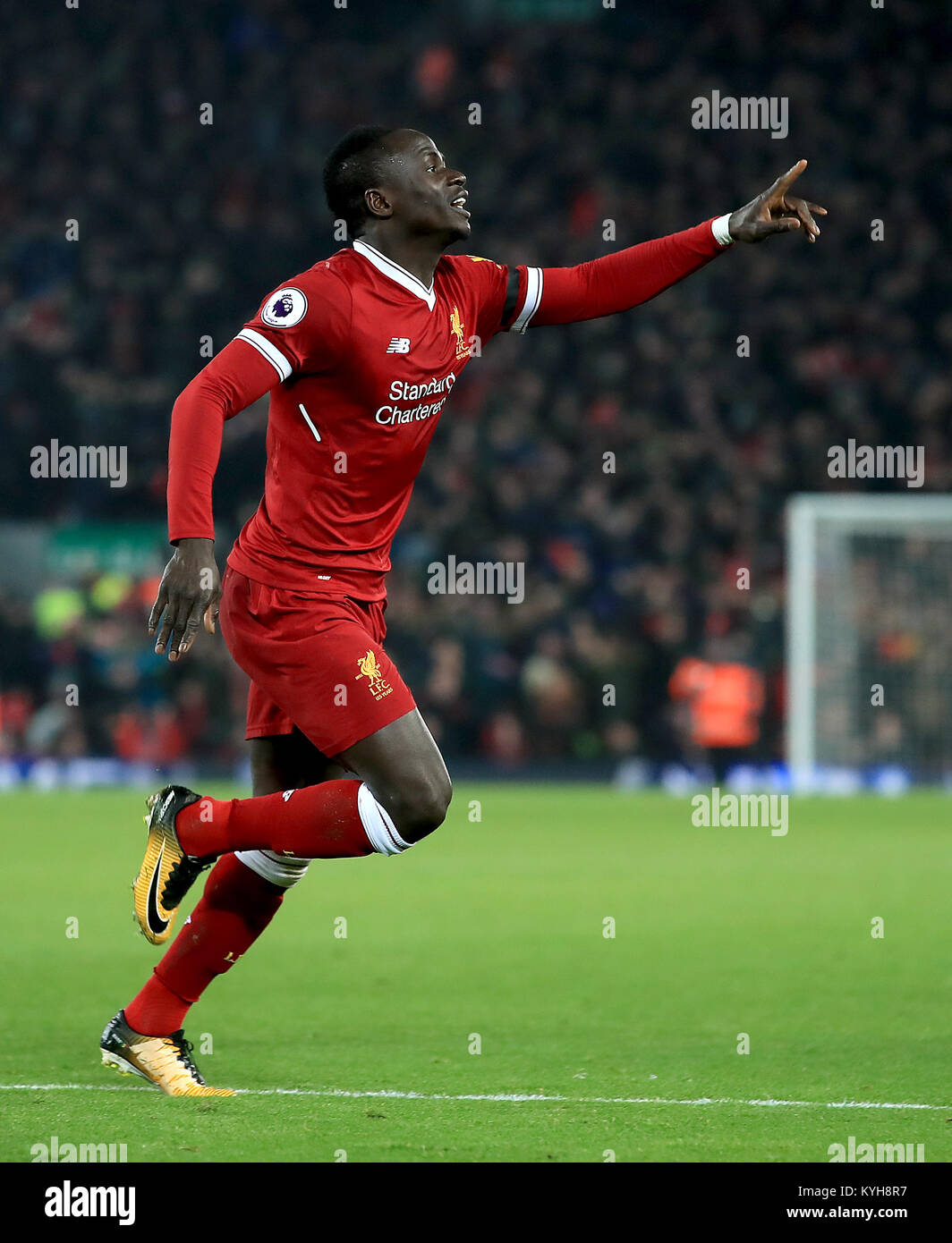 Liverpool's Sadio Mane celebrates scoring his side's third goal of the ...