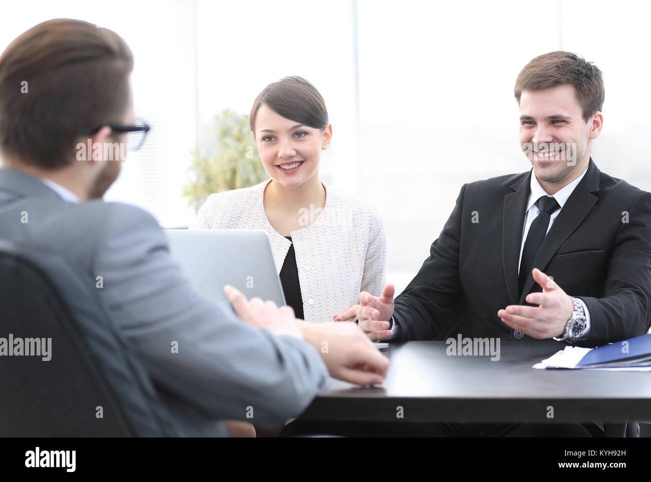 employees communicate with the customer in the office Stock Photo - Alamy