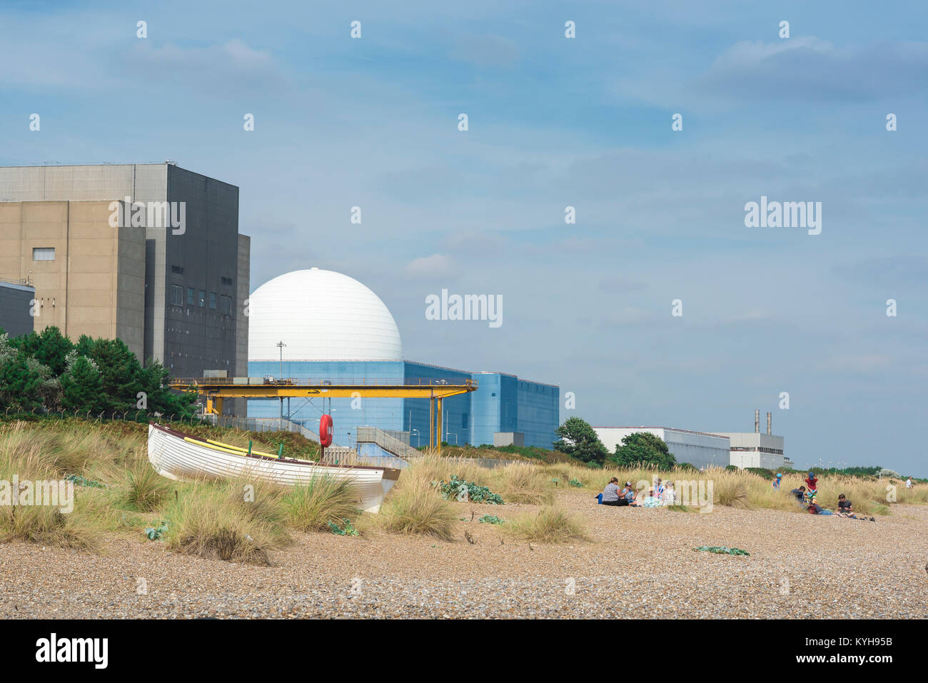 Suffolk beach summer, view of families having a picnic on a sandy beach ...