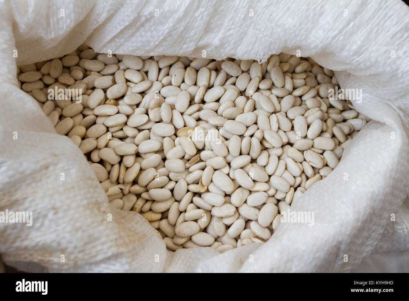 White beans in a sack for storage. Gluten free. Healthy food ...