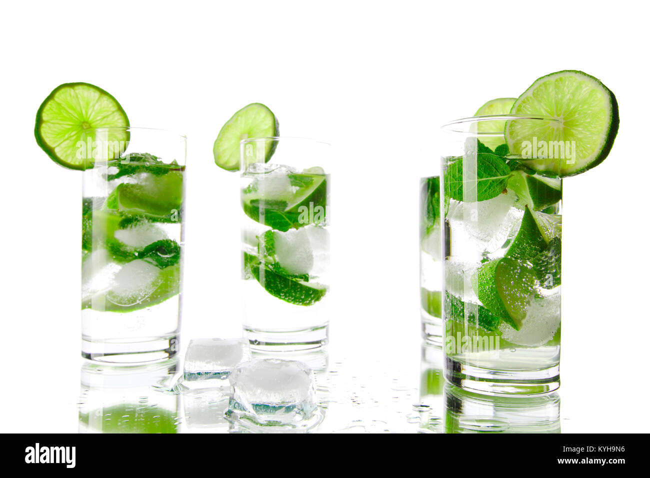 Party mojito cocktails with lime and mint isolated on white background ...