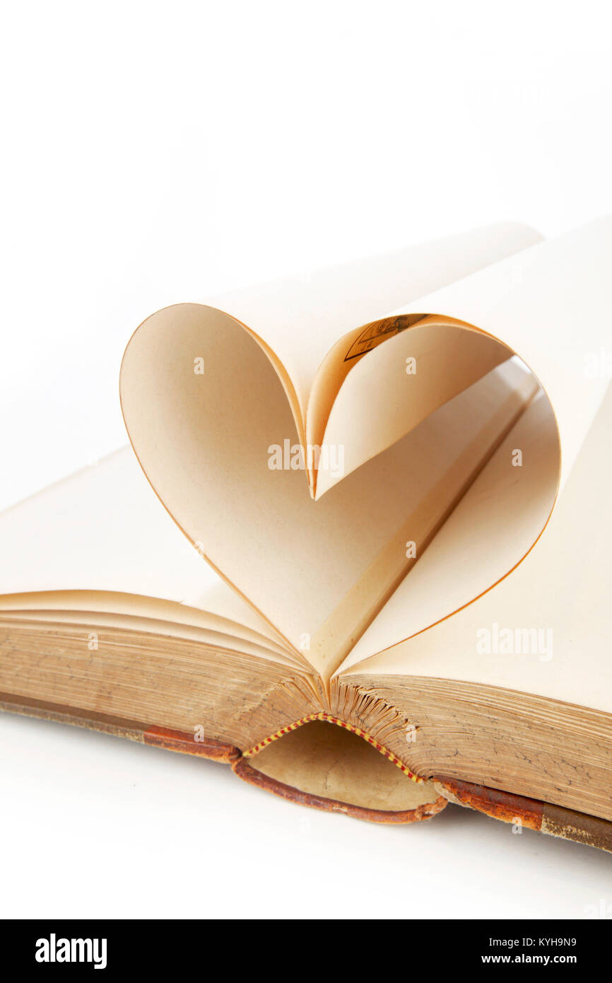 Heart shaped book pages on white background Stock Photo - Alamy
