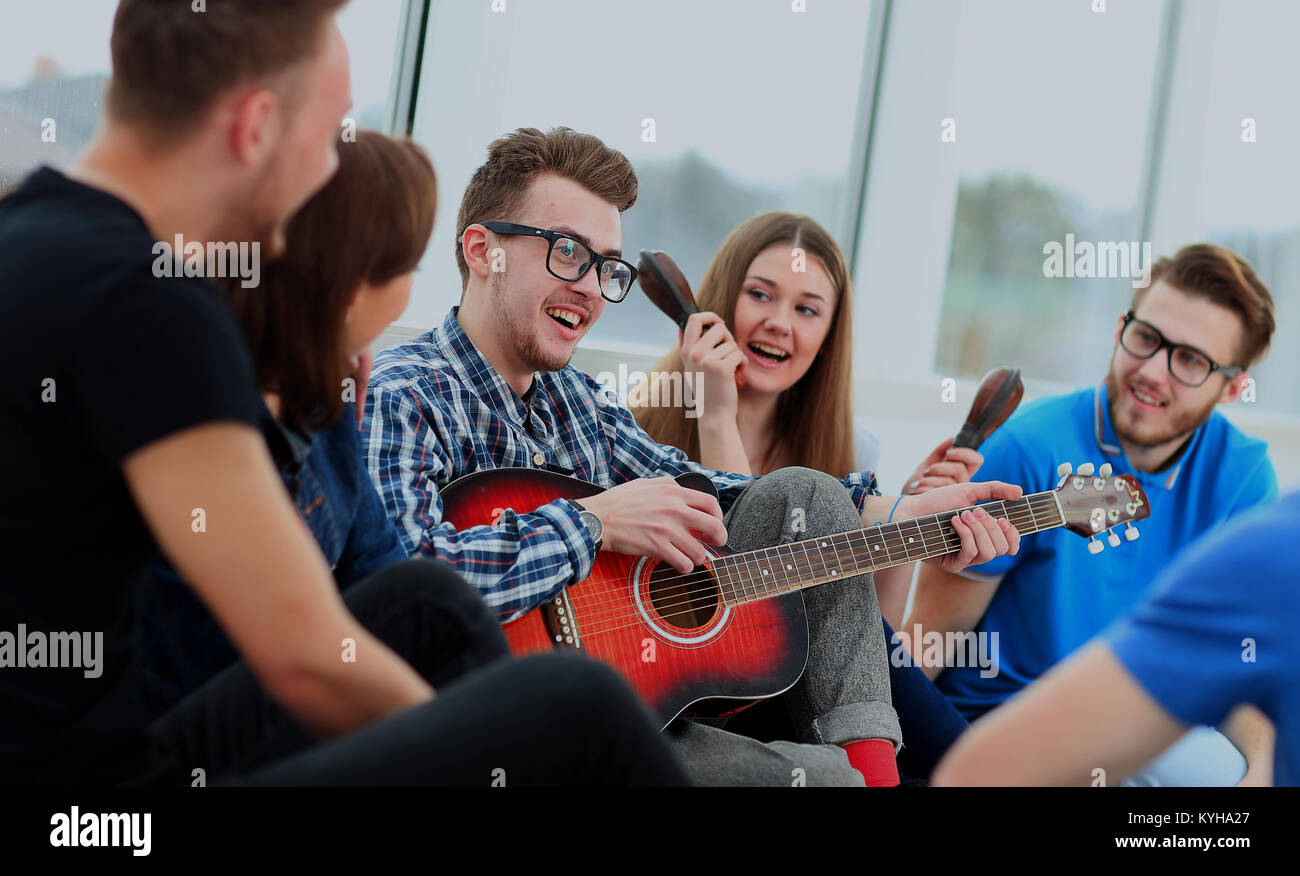 Young people playing the guitar Stock Photo - Alamy