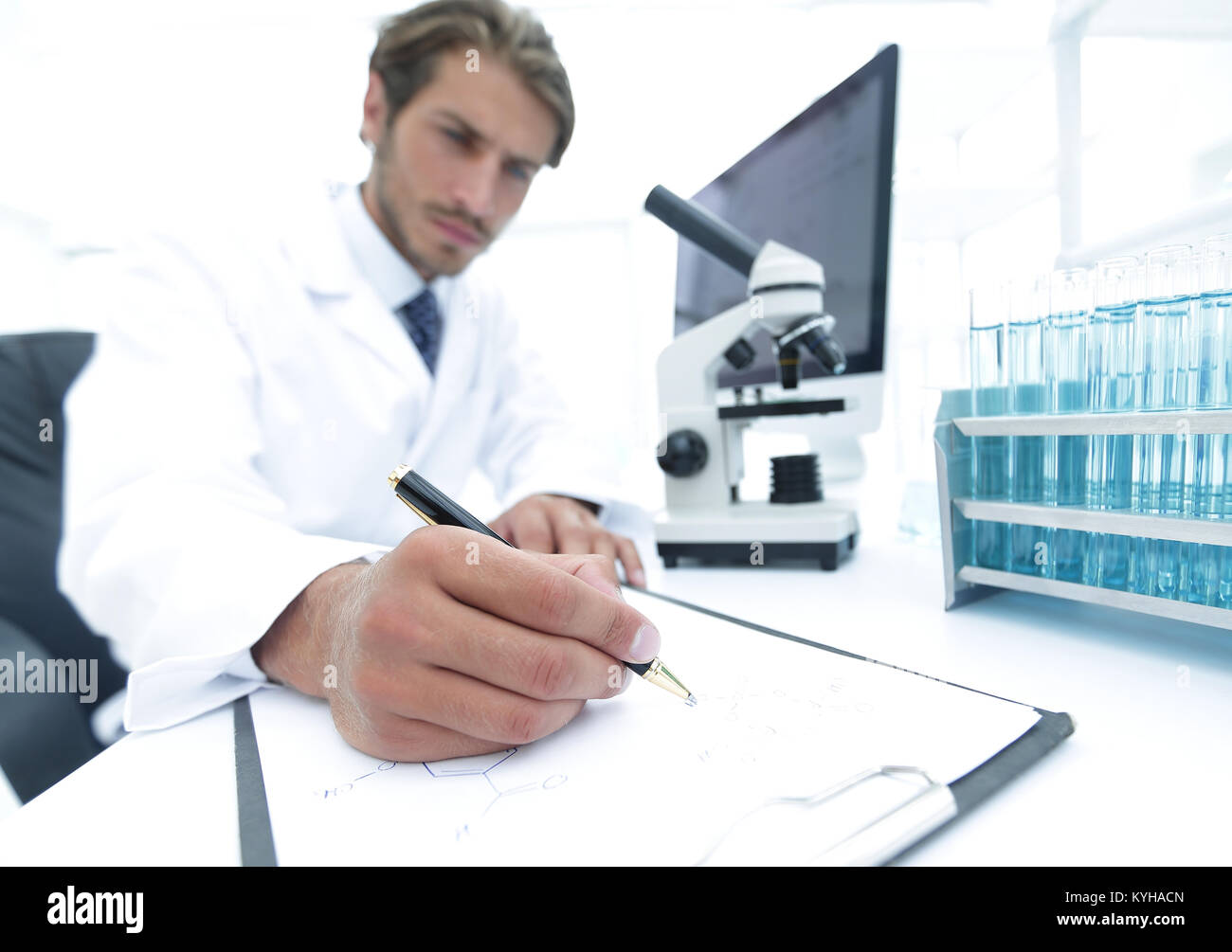 scientist makes a note of experiment in the laboratory Stock Photo - Alamy