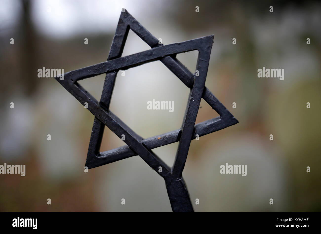 The Star of David close-up on top of a gravestone at Jewish cemetery in ...