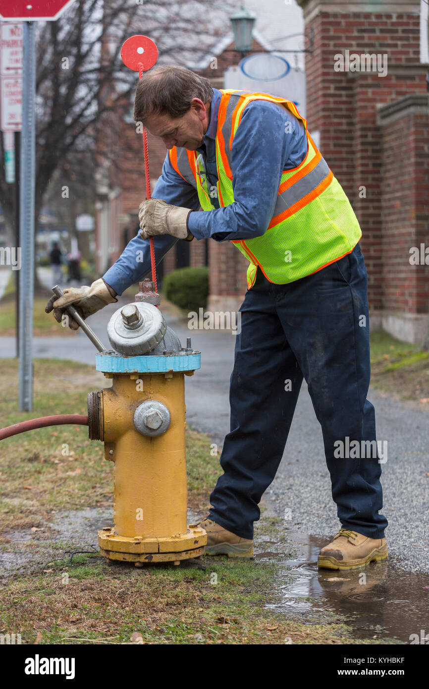 Water department technician installing a snow stake Stock Photo - Alamy