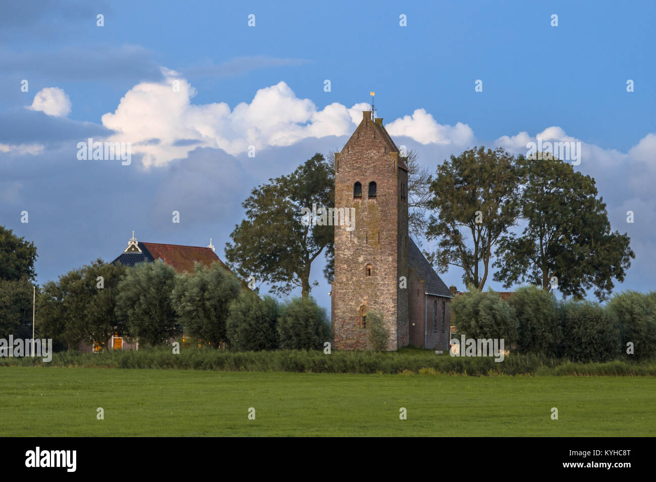 Church with tower in hamlet of Feytebuorren on frisian countryside near ...