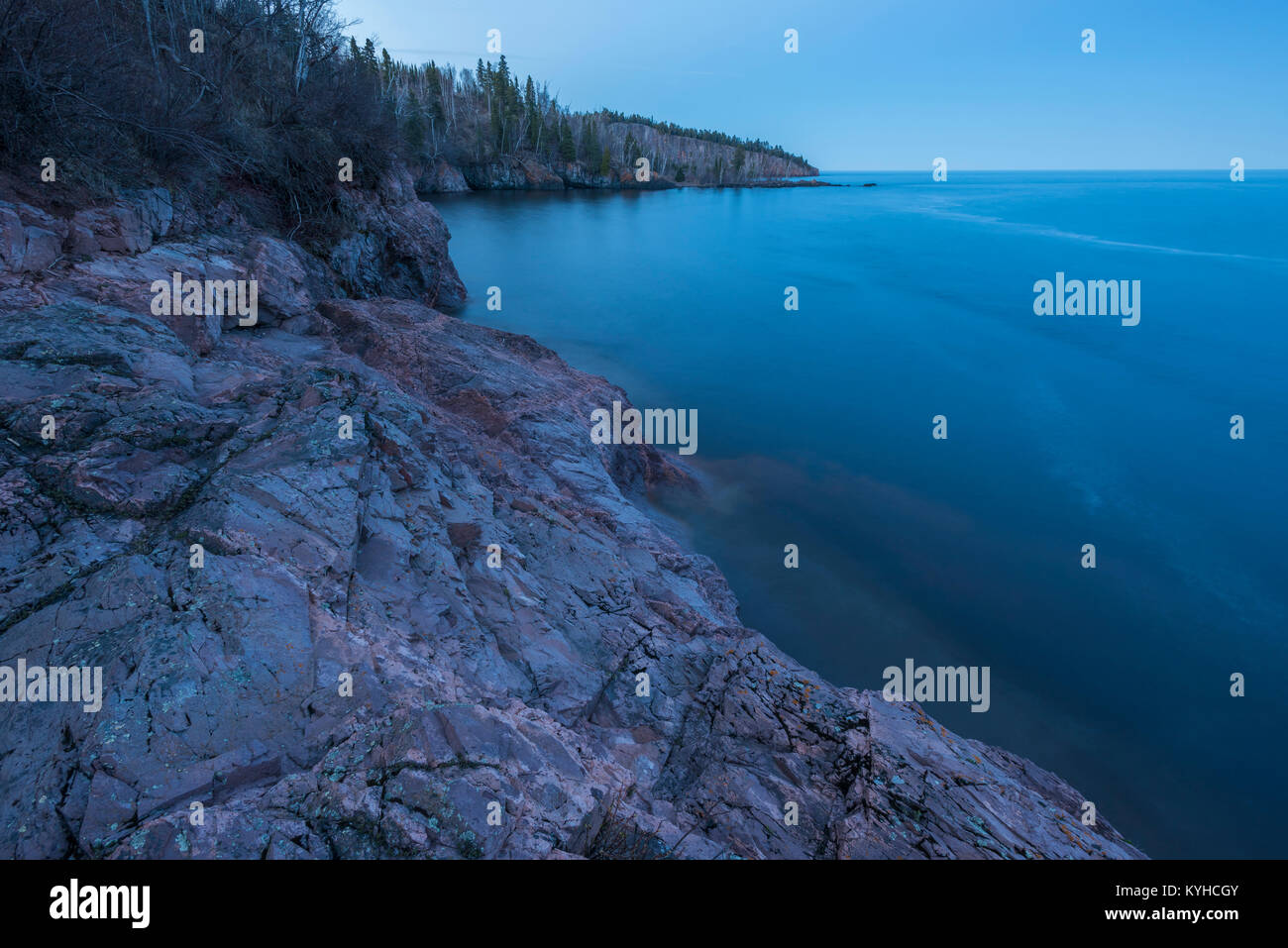 Sunset, Rhyolite cliffs near mouth Baptism River, Lake Superior ...