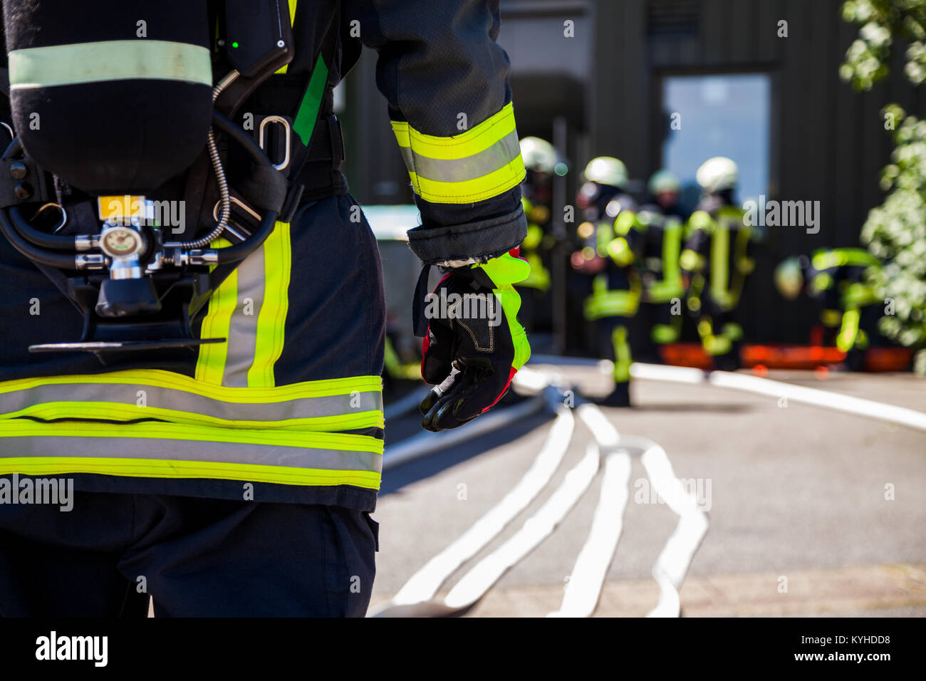 german fireman ( Feuerwehr ) stands near an accident Stock Photo - Alamy