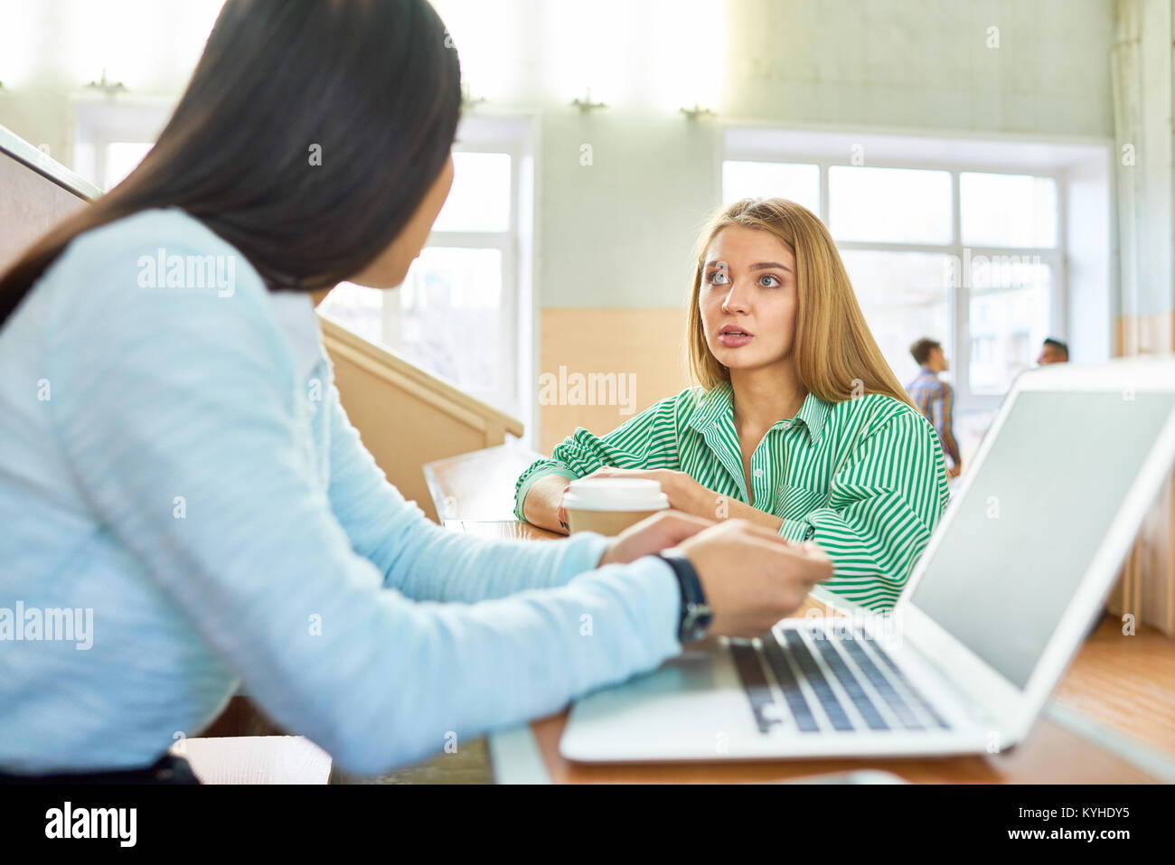Two girls talking class hi-res stock photography and images - Alamy