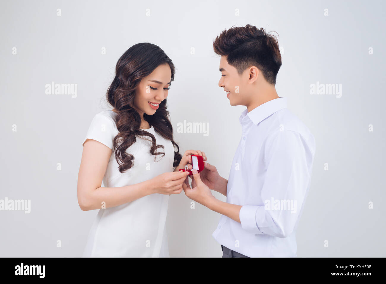 Proposal. Handsome man showing engagement diamond ring to his ...