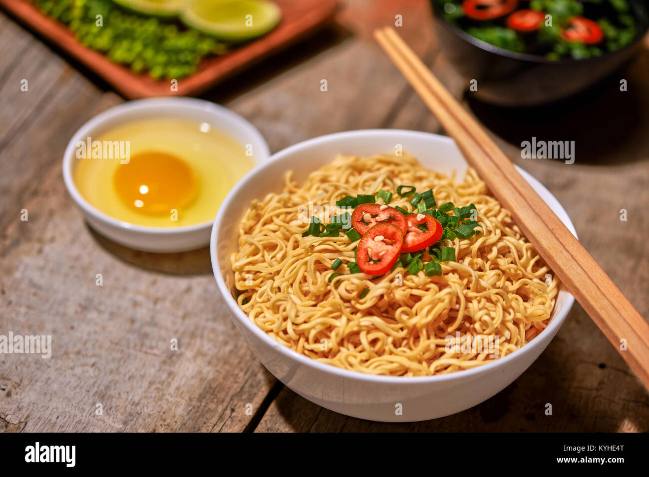 instant noodle in bowl cooked spicy taste topping with eggs Stock Photo ...
