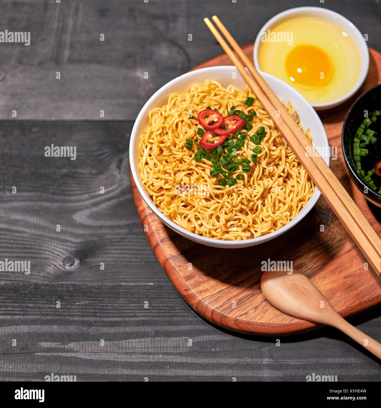 instant noodle in bowl cooked spicy taste topping with eggs Stock Photo ...