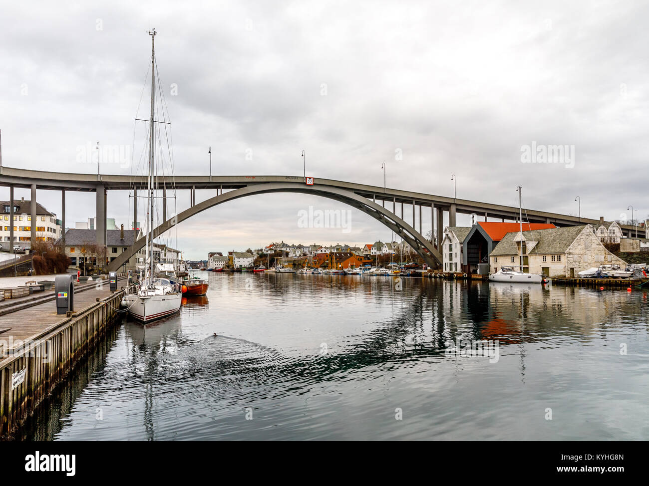 The Bridge to Risoya, sailboats in the canal in the city of Haugesund ...