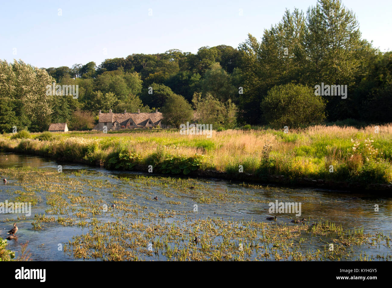Evening sun on Rack Isle and Arlington Row in picturesque Bibury ...
