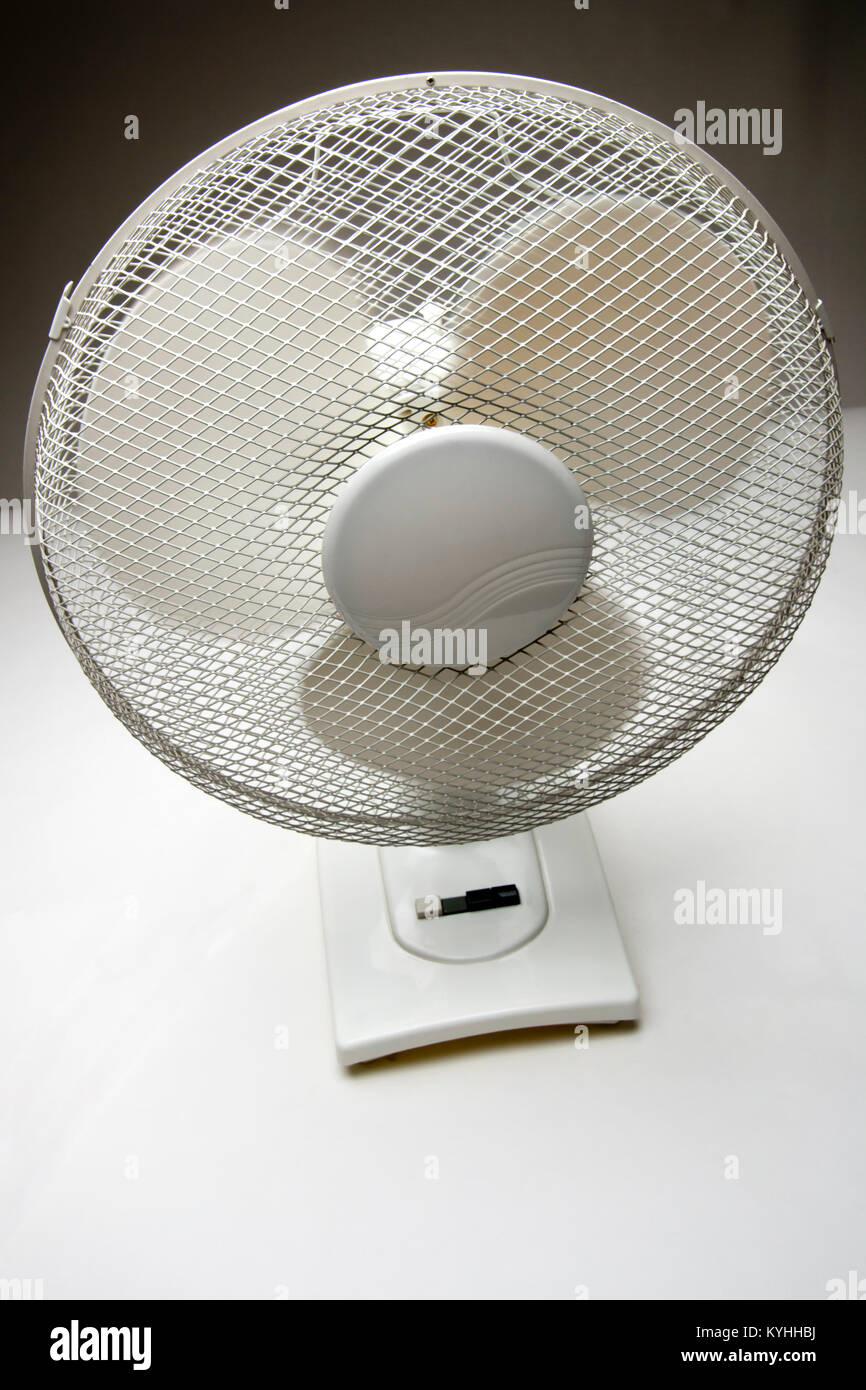 White desk fan Stock Photo - Alamy