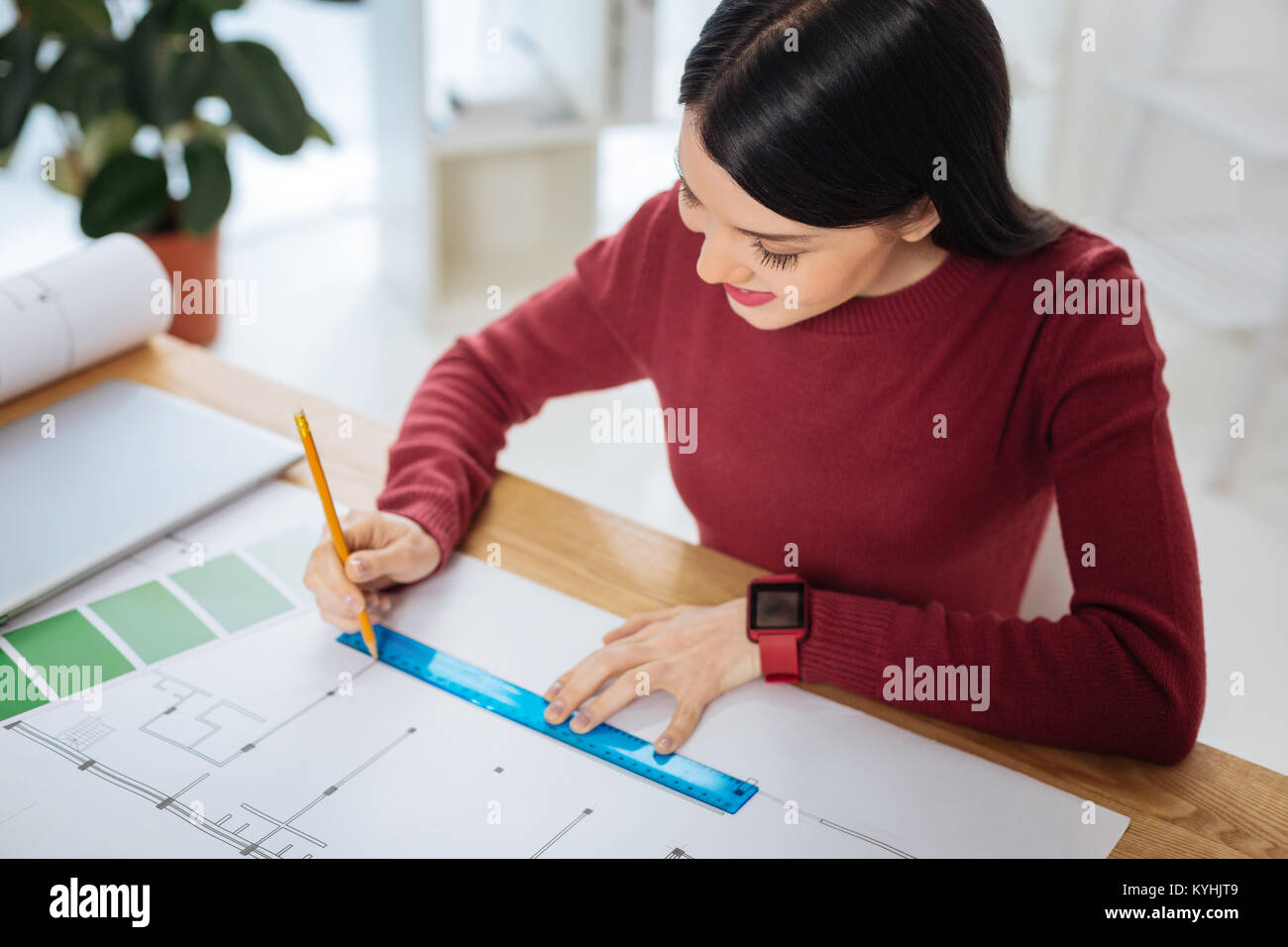 Careful engineer doing her work while drawing neat lines Stock Photo ...