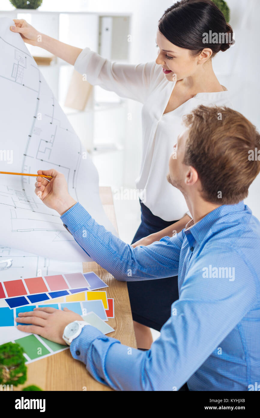 Young engineer showing her drawing to an experienced colleague Stock ...