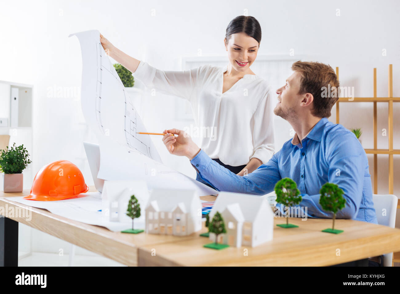 Calm colleagues talking about their new project and looking interested ...