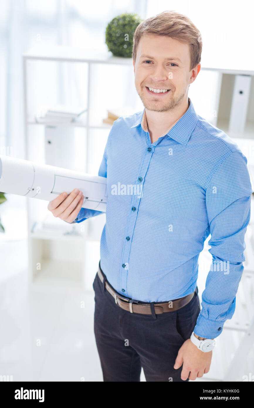 Excited smart engineer smiling happily while being at work Stock Photo ...