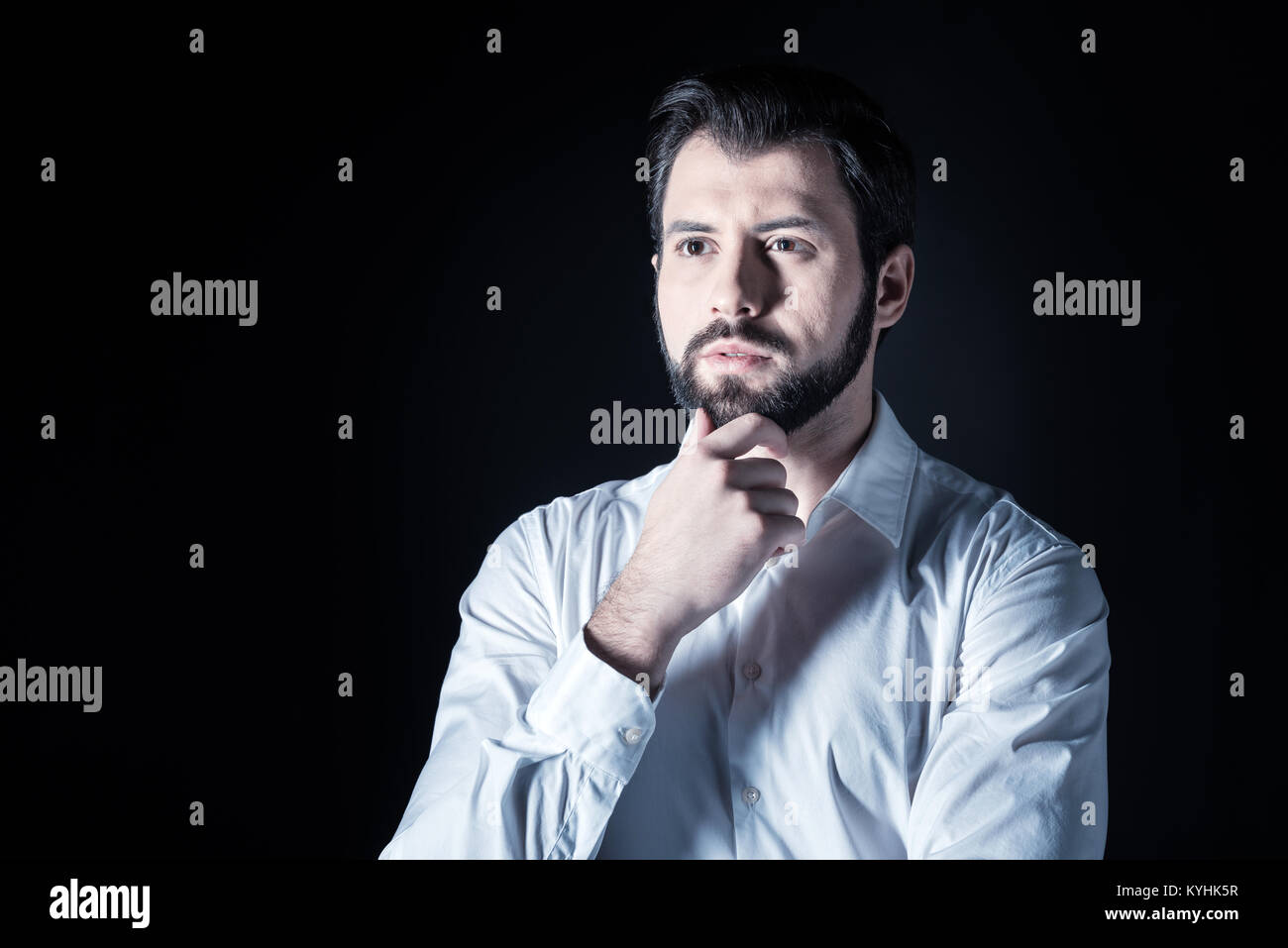 Pleasant handsome man looking in front of him Stock Photo - Alamy