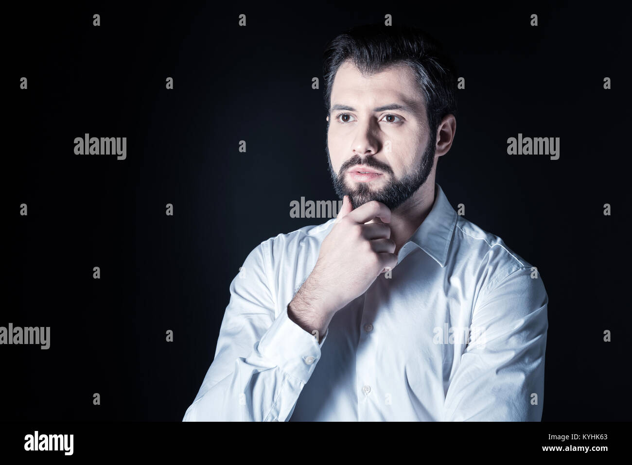Serious smart man focusing on his thoughts Stock Photo - Alamy