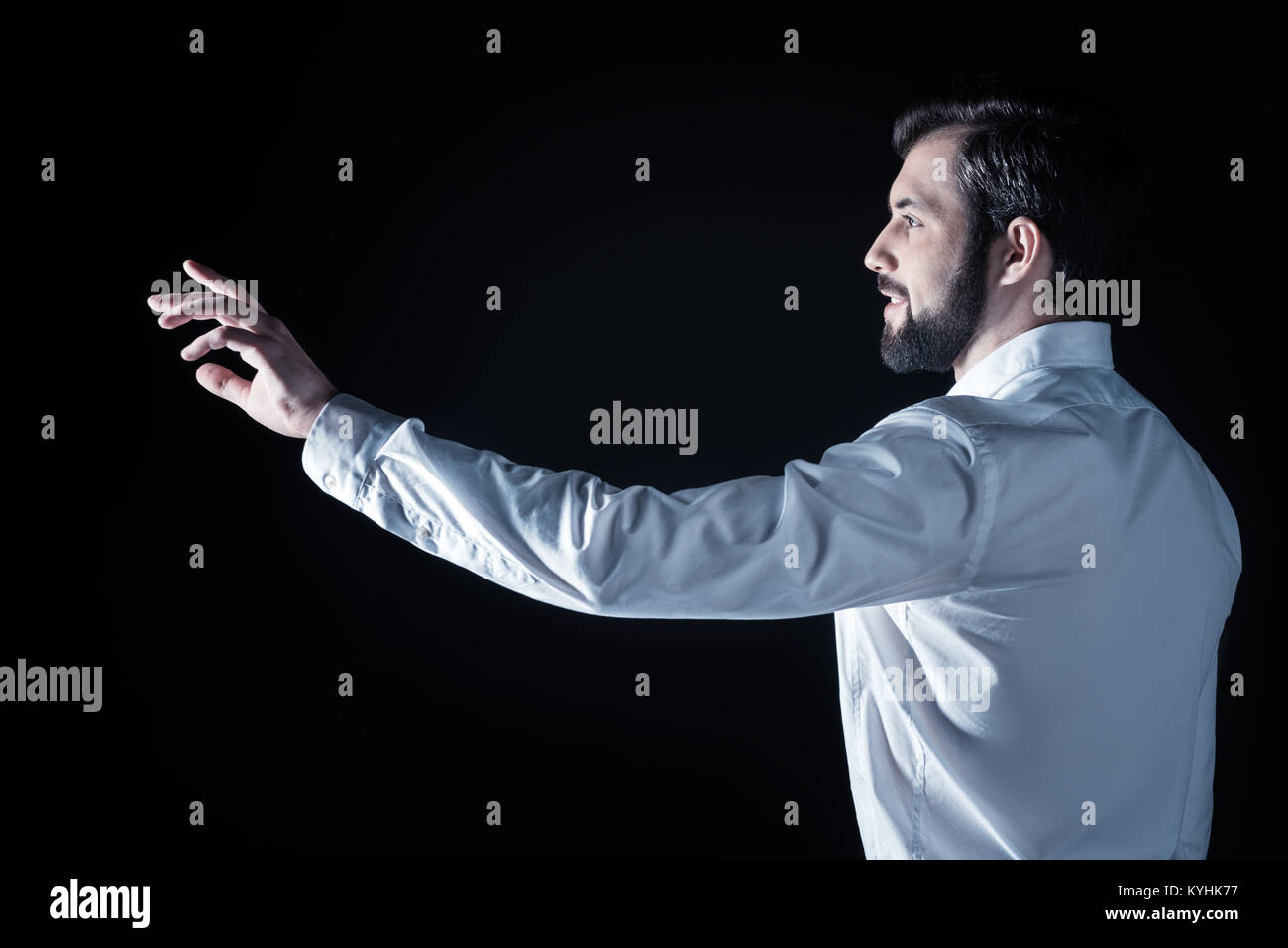 Nice handsome man stretching out his hand Stock Photo - Alamy