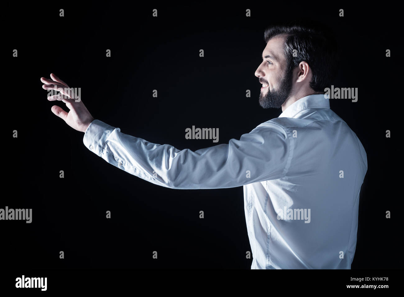 Handsome happy man touching the virtual screen Stock Photo - Alamy