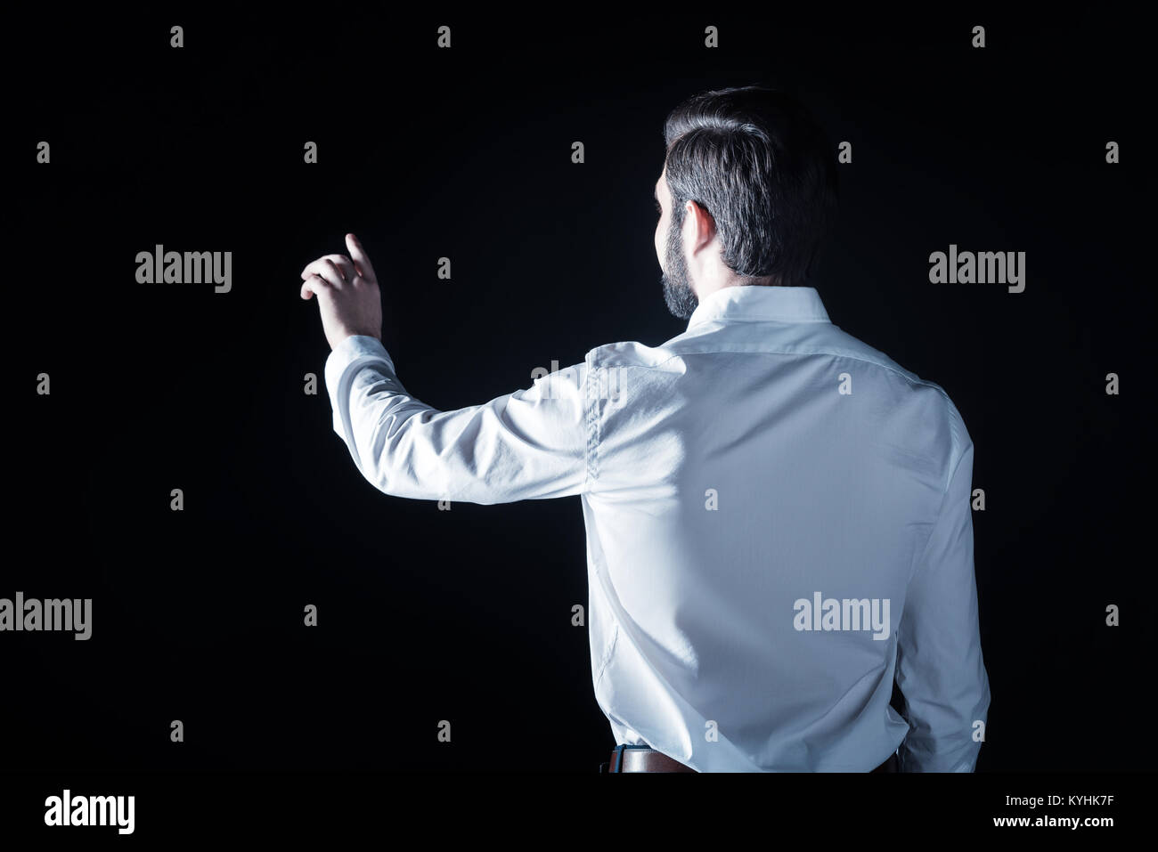Handsome brutal man turning his back to you Stock Photo - Alamy