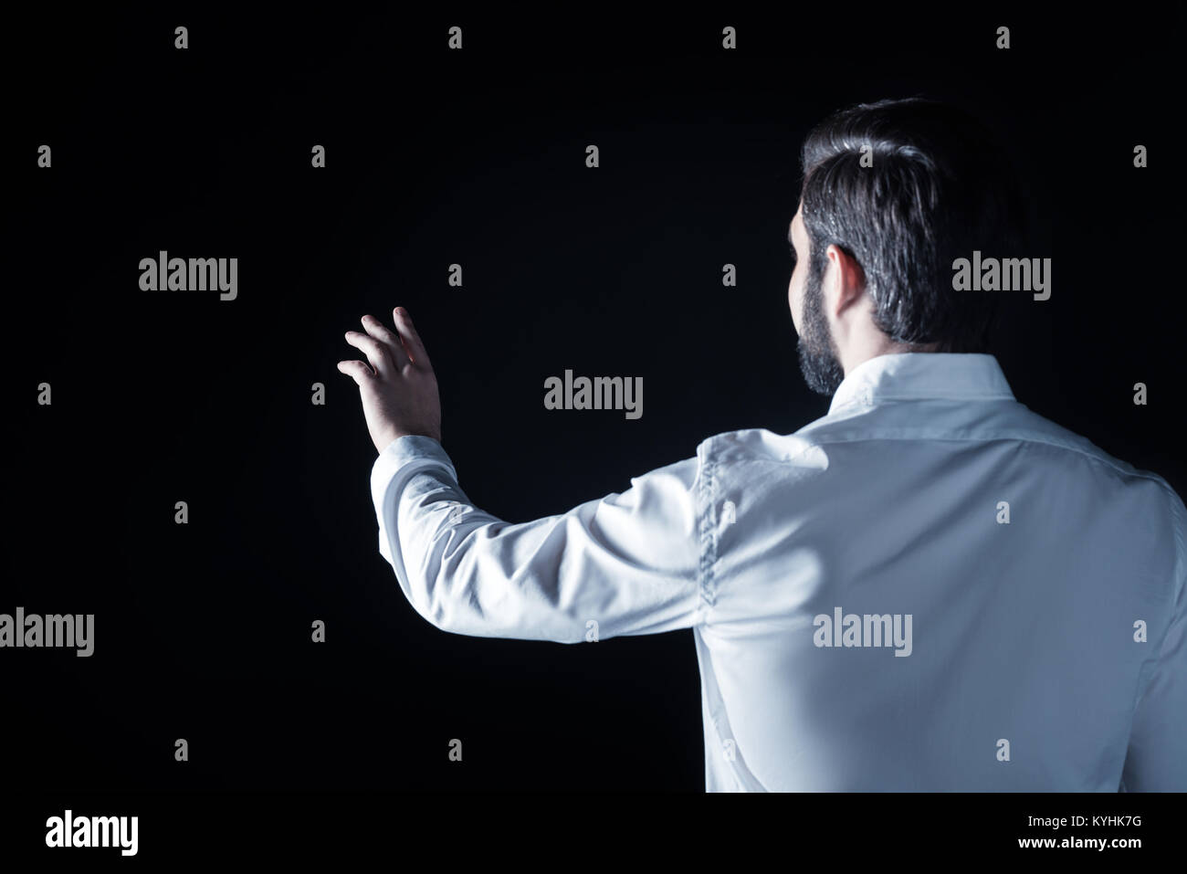 Nice smart man touching transparent screen Stock Photo - Alamy