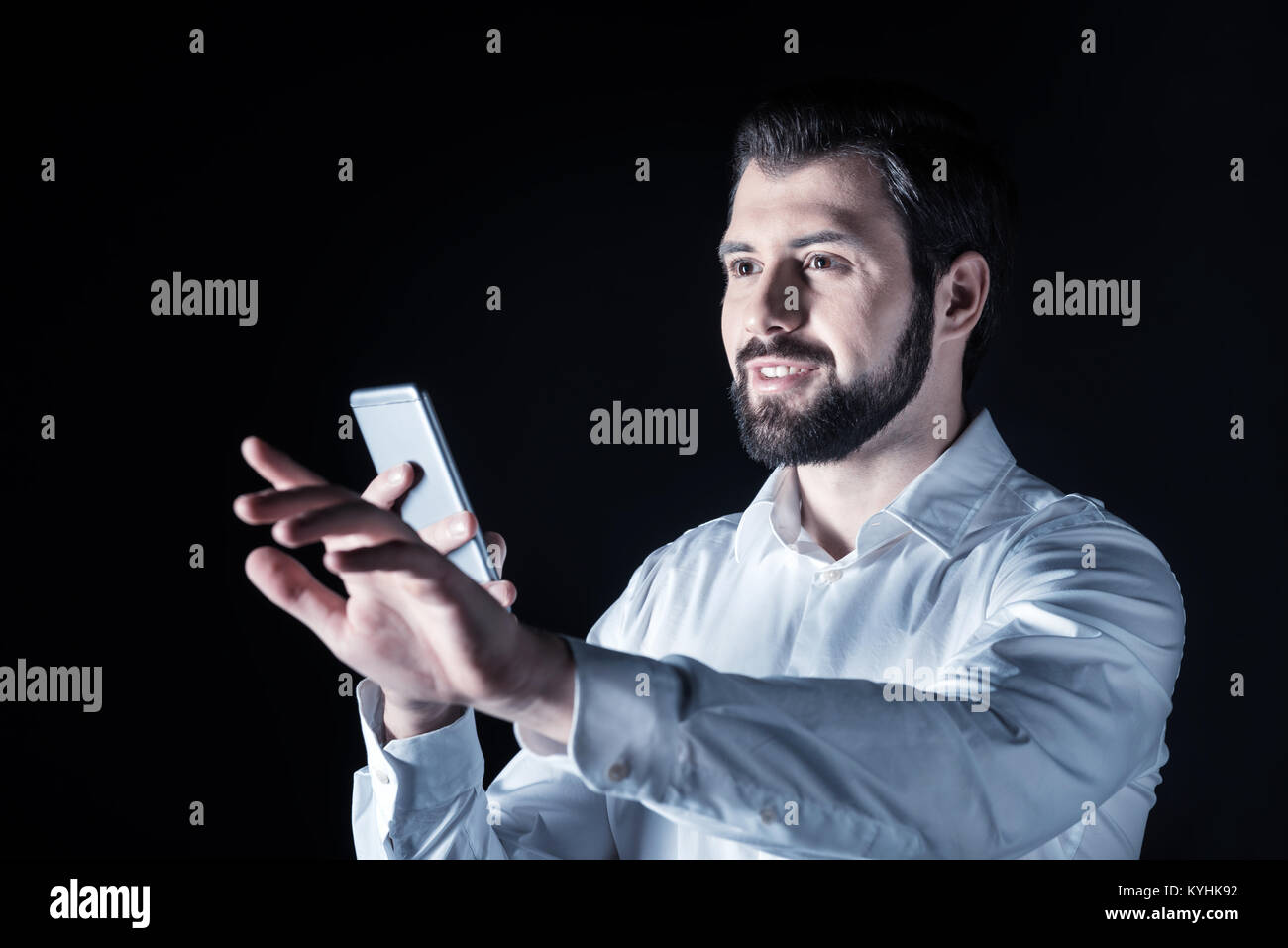 Cheerful delighted man looking in front of him Stock Photo - Alamy