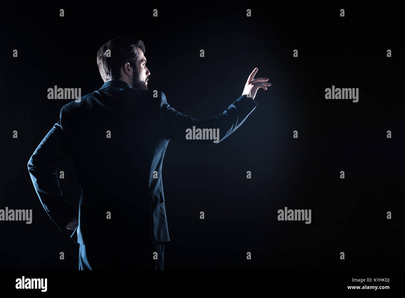 Professional serious businessman holding his hand up Stock Photo - Alamy