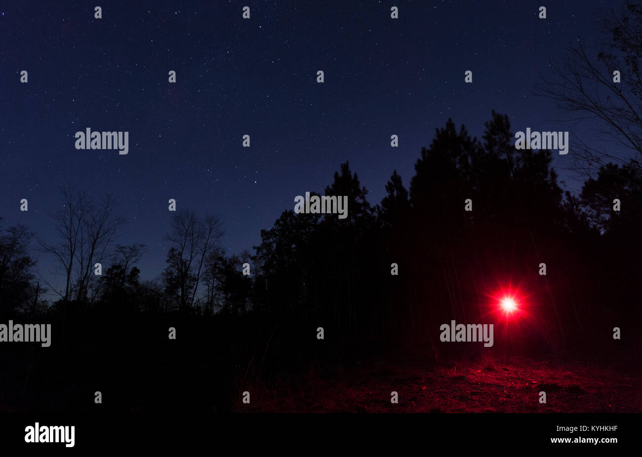 Bright red light marking the spot of someone in an emergency at night ...