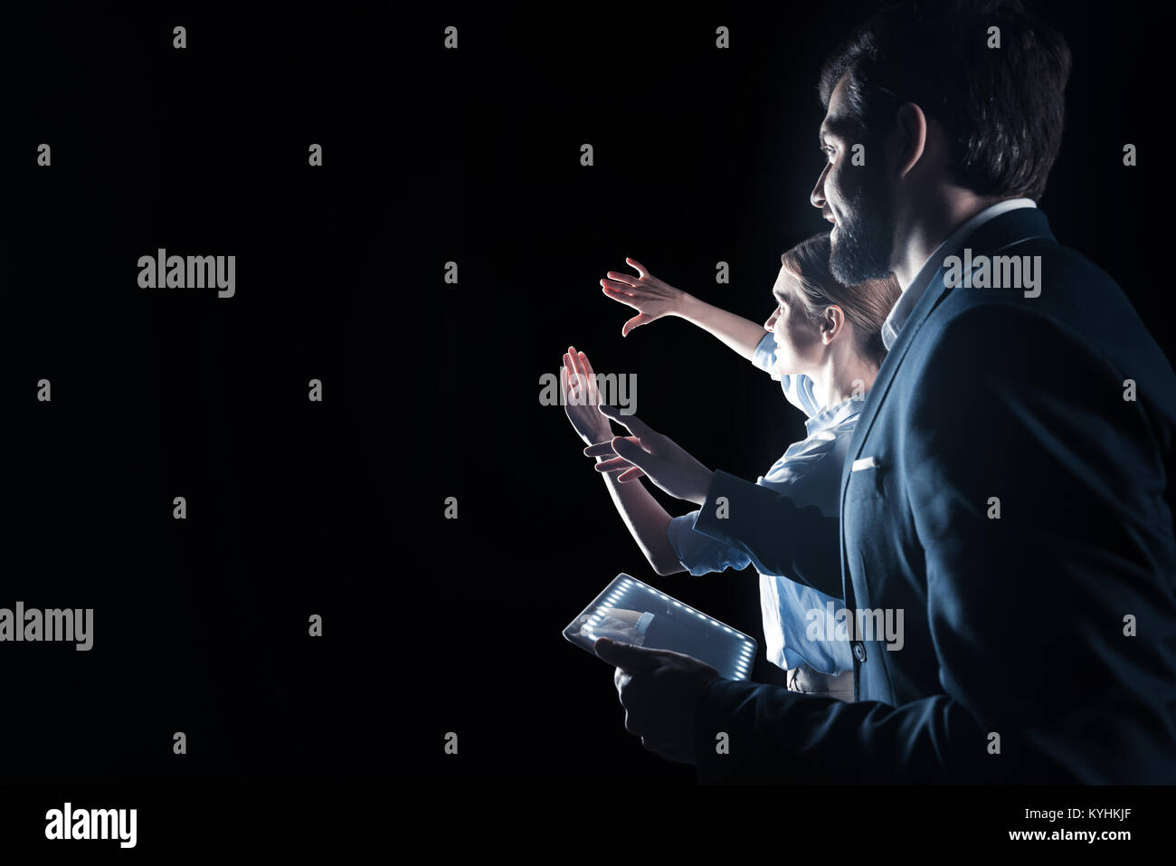 Happy delighted people working together Stock Photo - Alamy