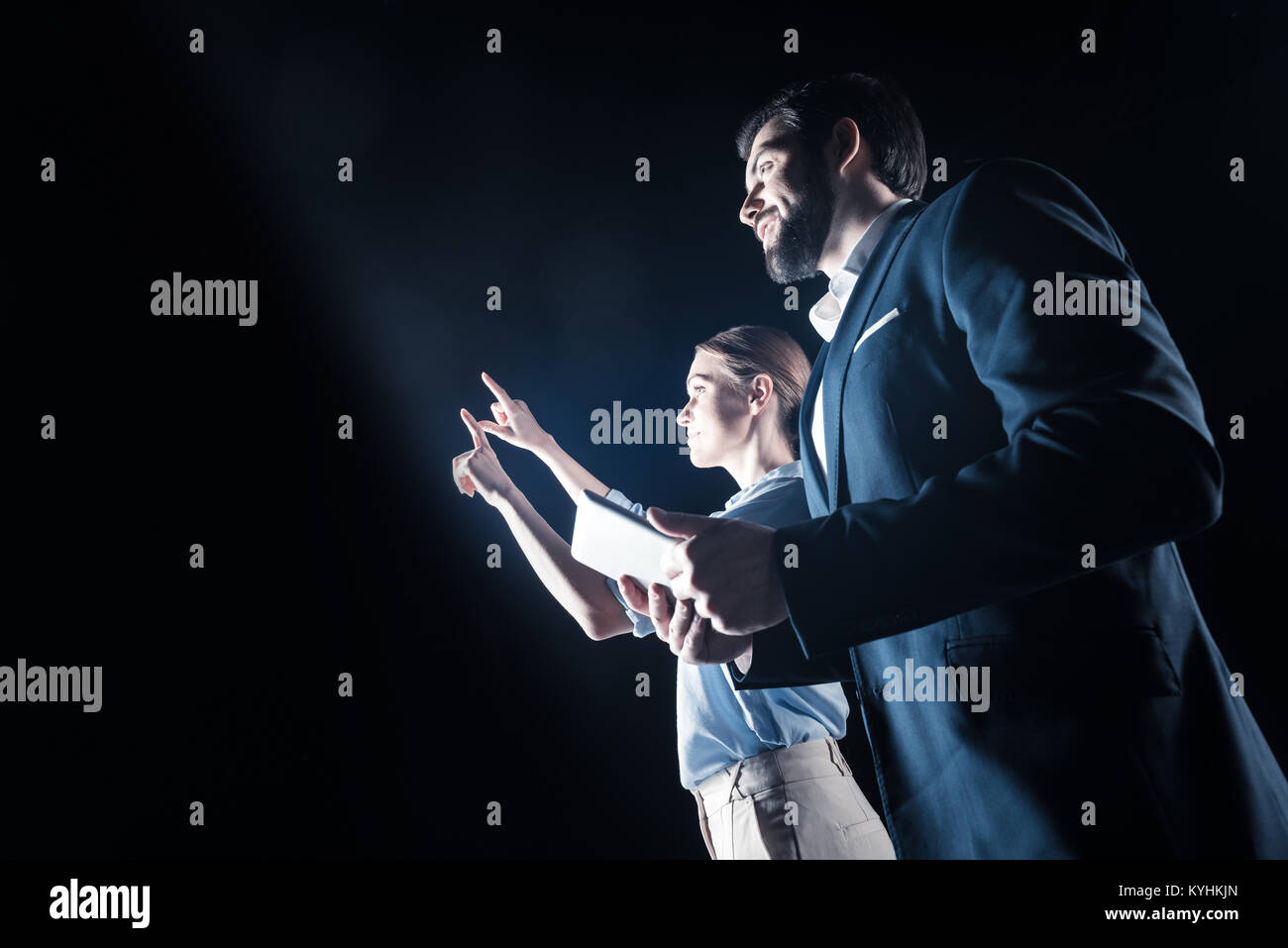 Nice smart colleagues working in team Stock Photo - Alamy