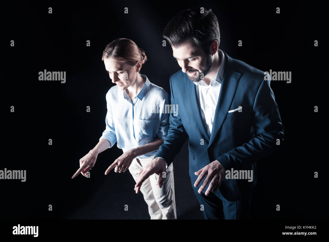 Nice delighted businesspeople touching virtual objects Stock Photo - Alamy