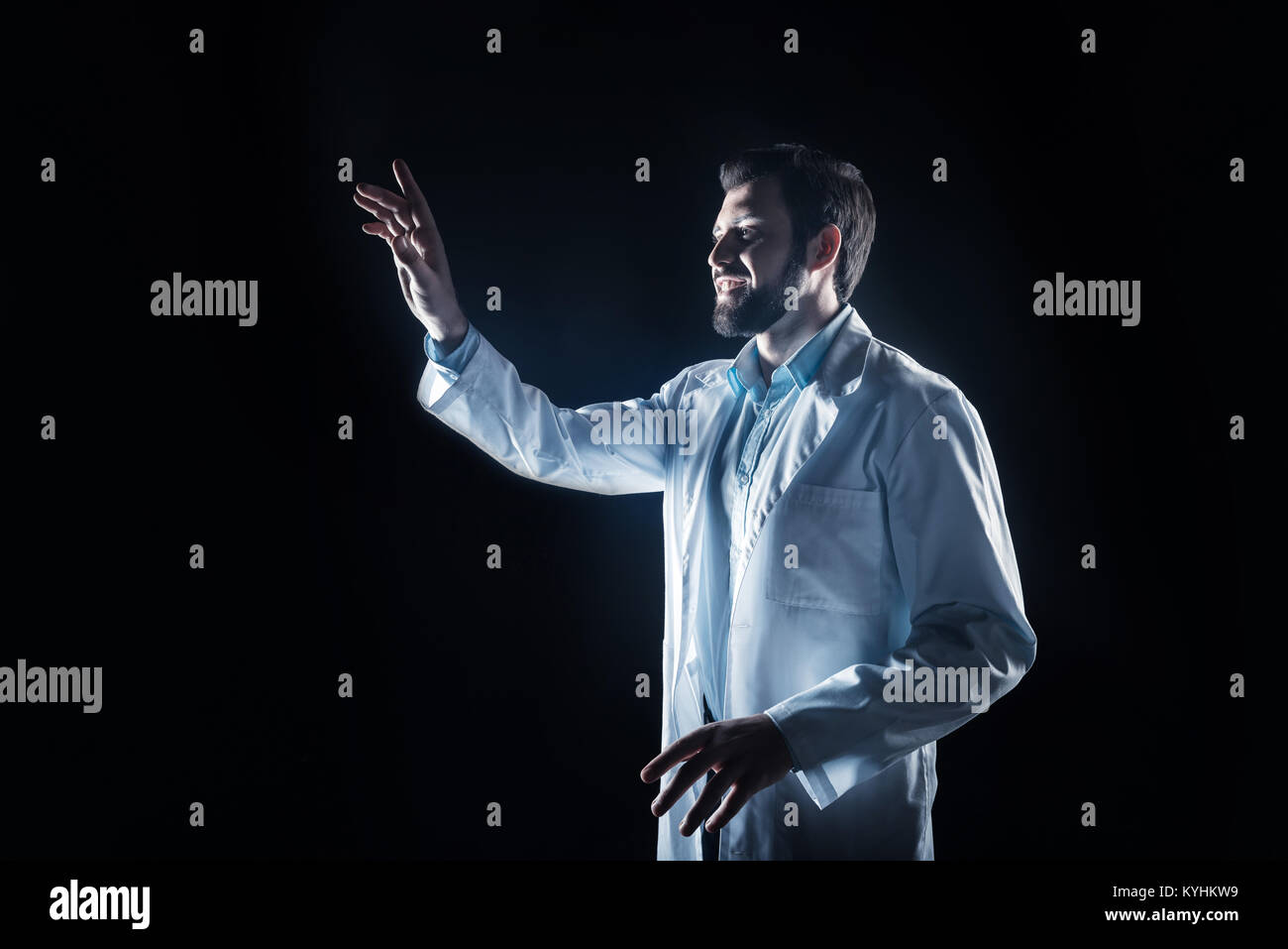 Happy smart scientist looking at the sensory screen Stock Photo - Alamy