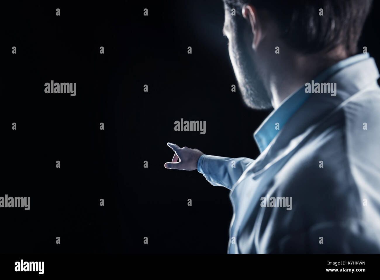 Nice smart man looking at his hand Stock Photo - Alamy