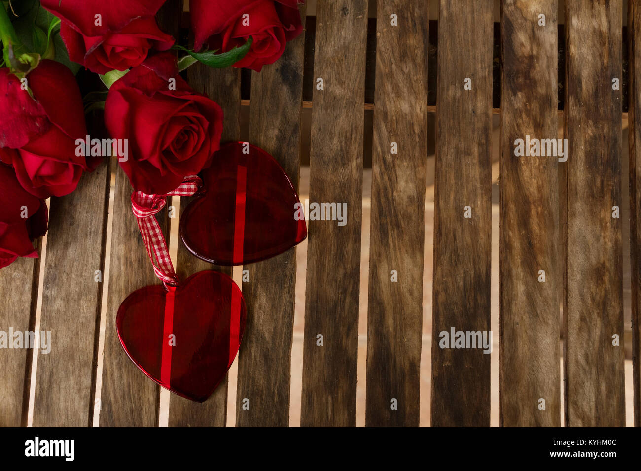 dark red roses on table Stock Photo - Alamy