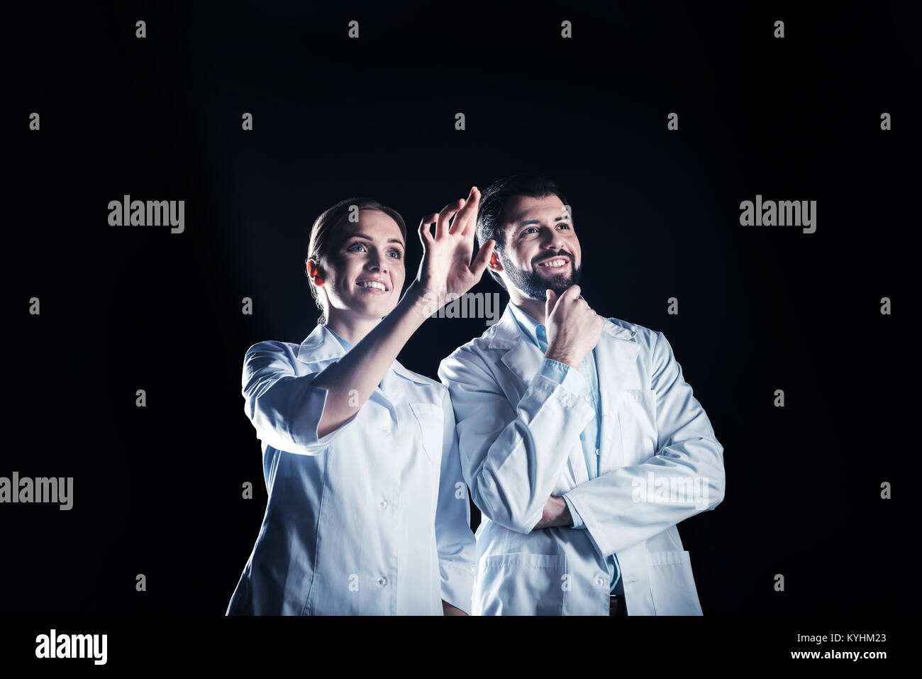 Handsome bearded scientist holding his chin Stock Photo - Alamy