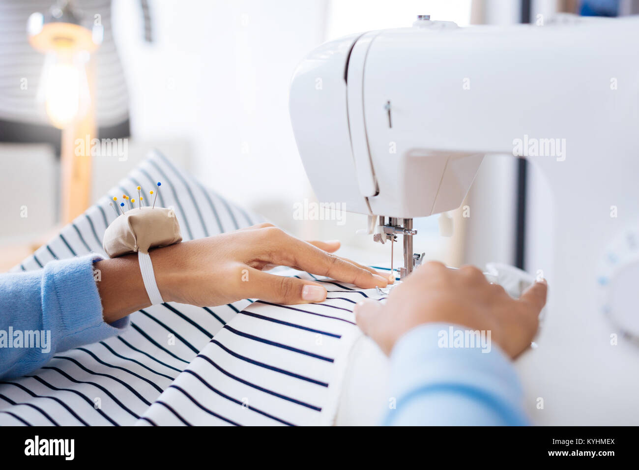 Calm worker of a professional atelier working on a sewing machine Stock ...