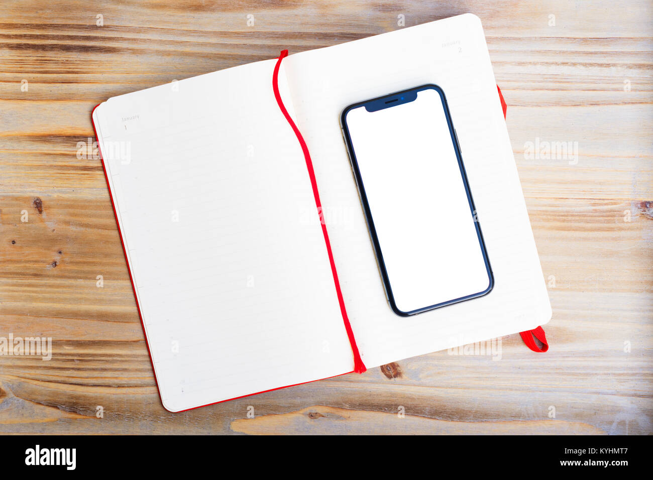 Notebook with phone Stock Photo - Alamy