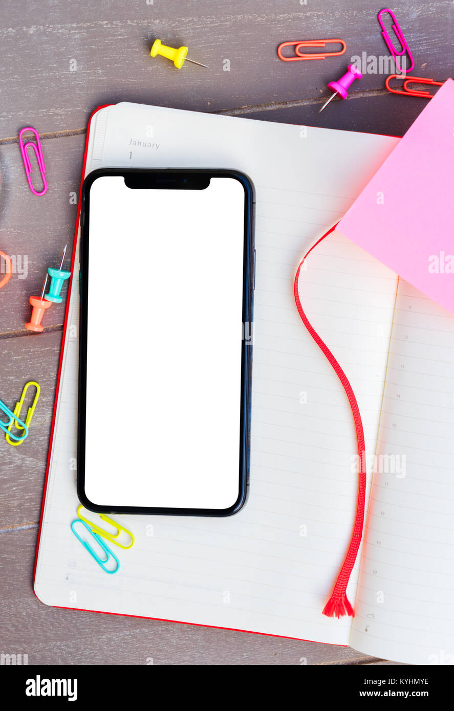 open notebook and phone Stock Photo - Alamy