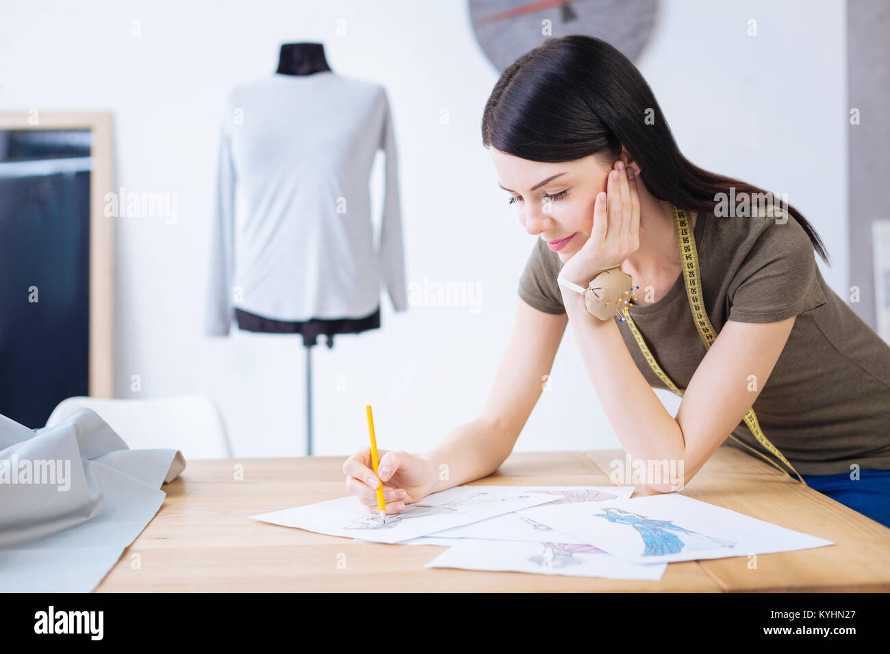 Peaceful woman drawing while being at work Stock Photo - Alamy