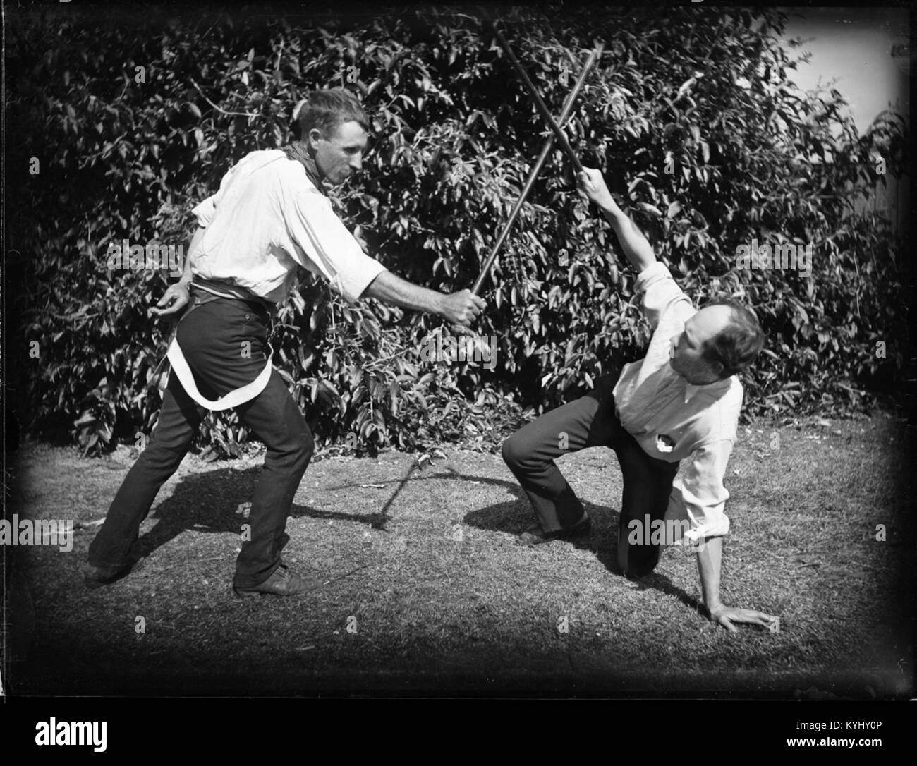 Photograph depicting two men engaged in fencing, showing sport ...