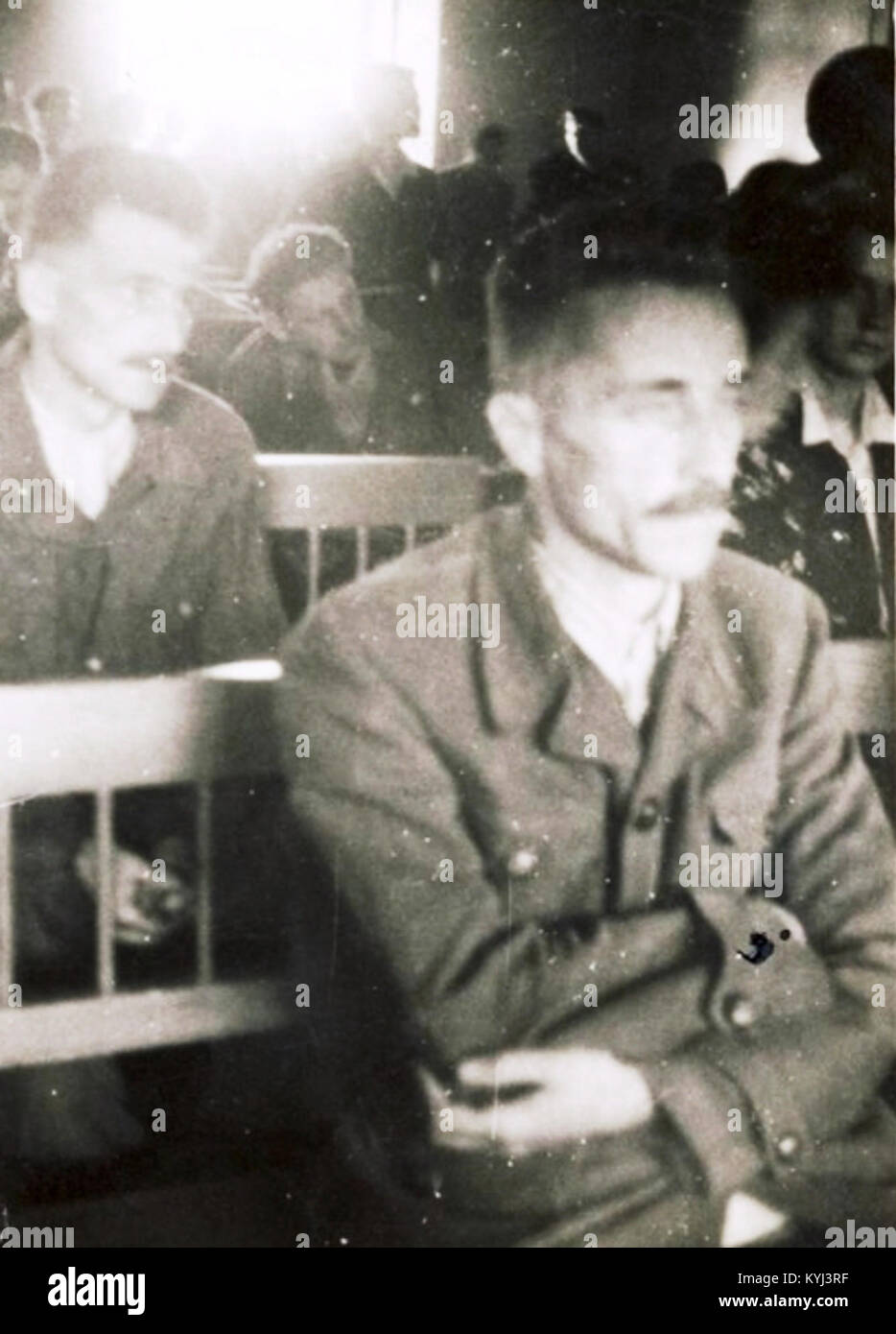This photograph shows the trial of a war criminal at the Old County ...