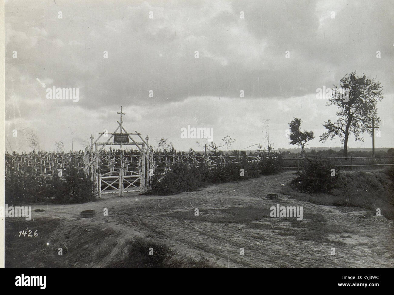 This historical image depicts a soldiers’ cemetery and memorials at a ...